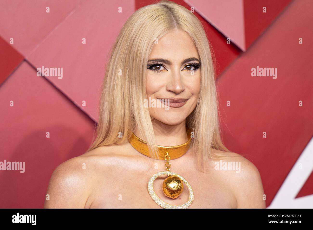 Pixie Lott poses for photographers upon arrival at the British Fashion Awards in London, Monday ...