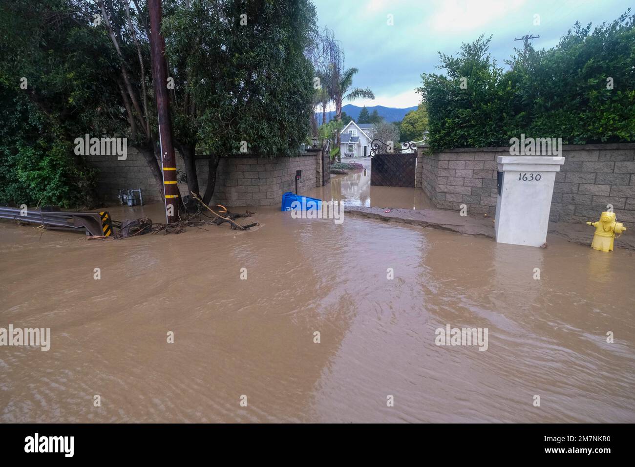 A driveway is flooded by the overflowing San Ysidro creek on Jameson ...