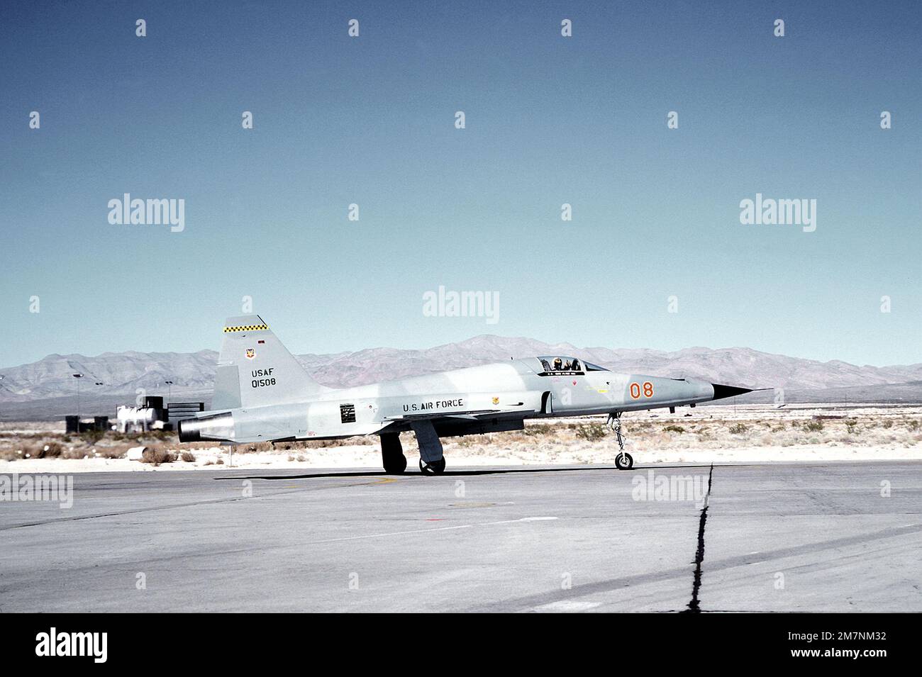 Right side view of an F-5E Tiger II aircraft on the flight line ready ...