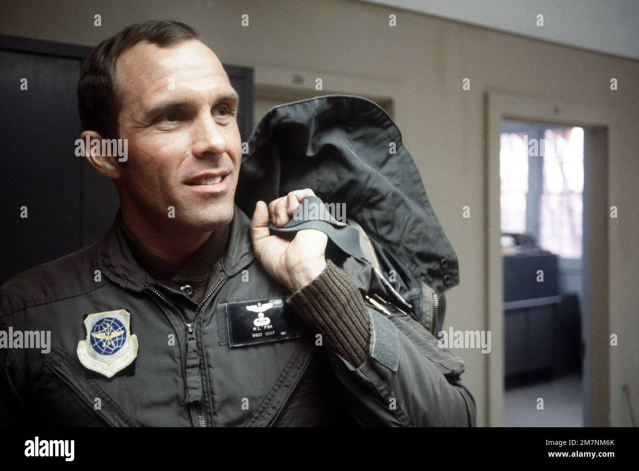 MSGT Wayne L. Fisk is issued a rough terrain parajump suit, while ...