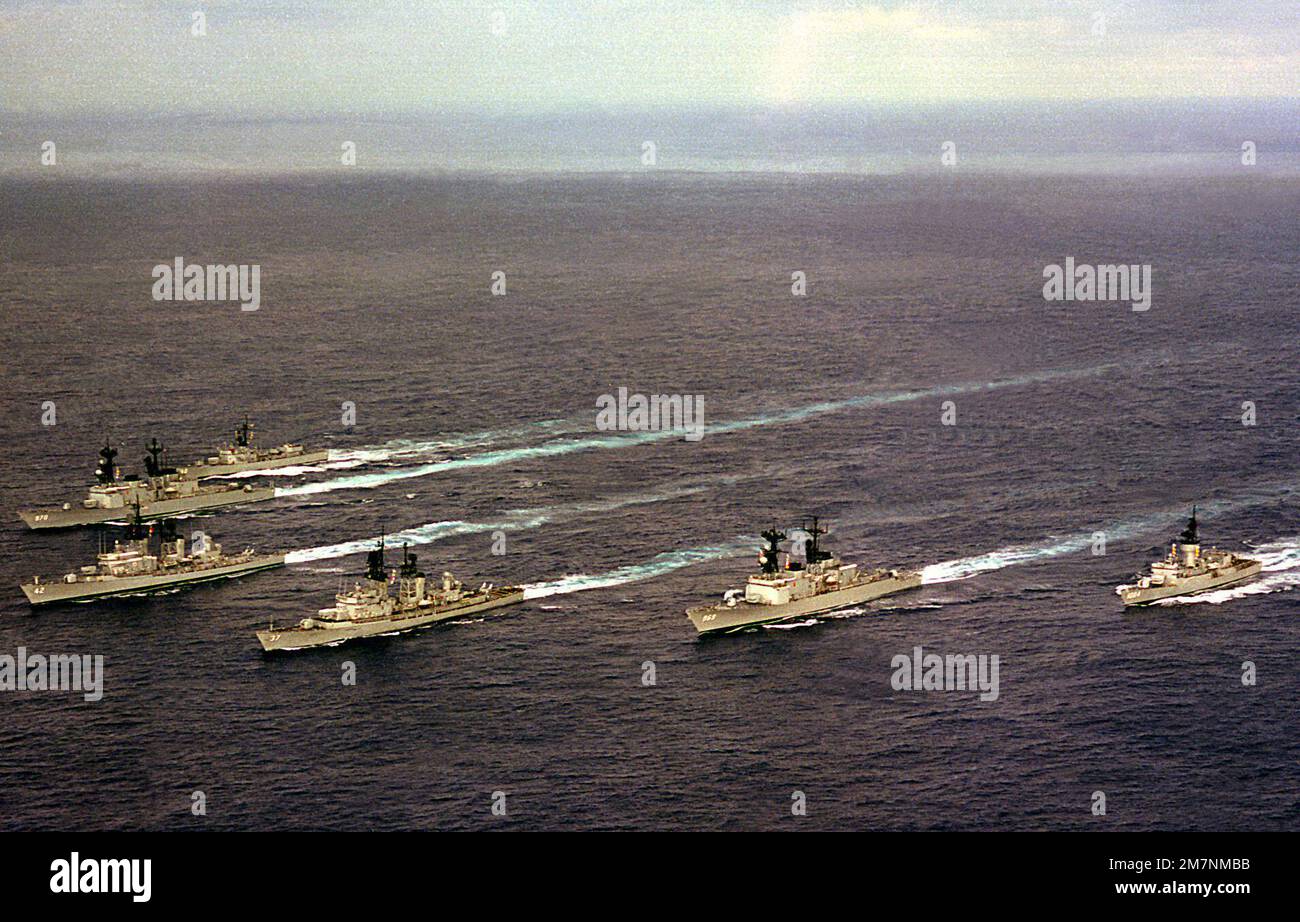 An aerial port bow view of six ships in the USS INDEPENDENCE (CV-62 ...