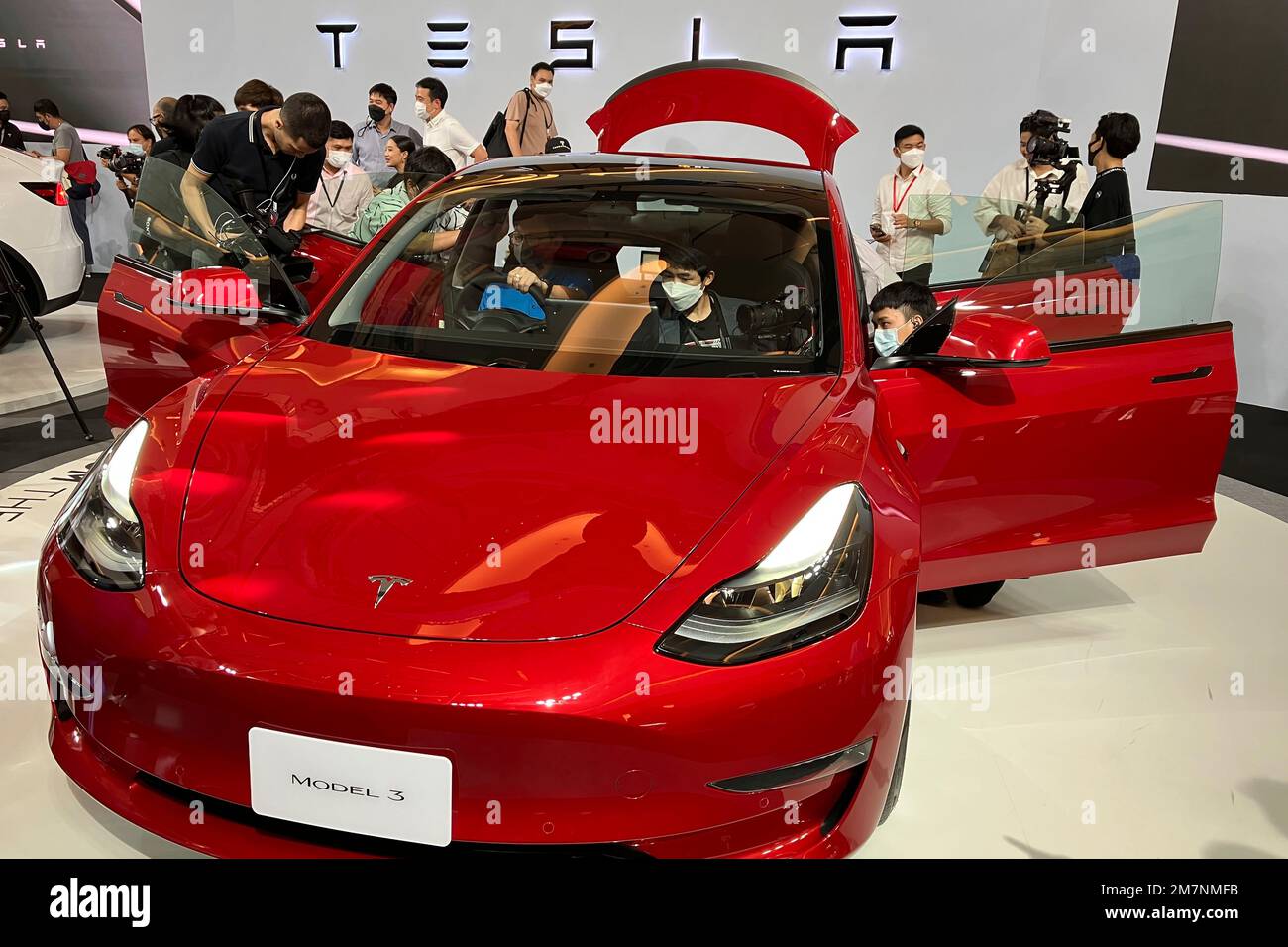 Tesla electric vehicles are displayed during a public launching event ...