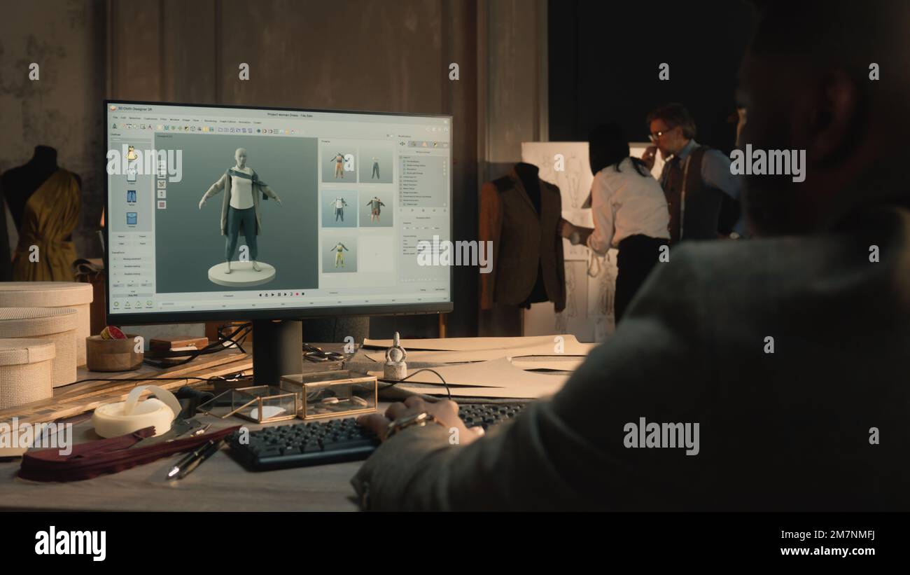 African American tailor or fashion designer creates clothes and ...