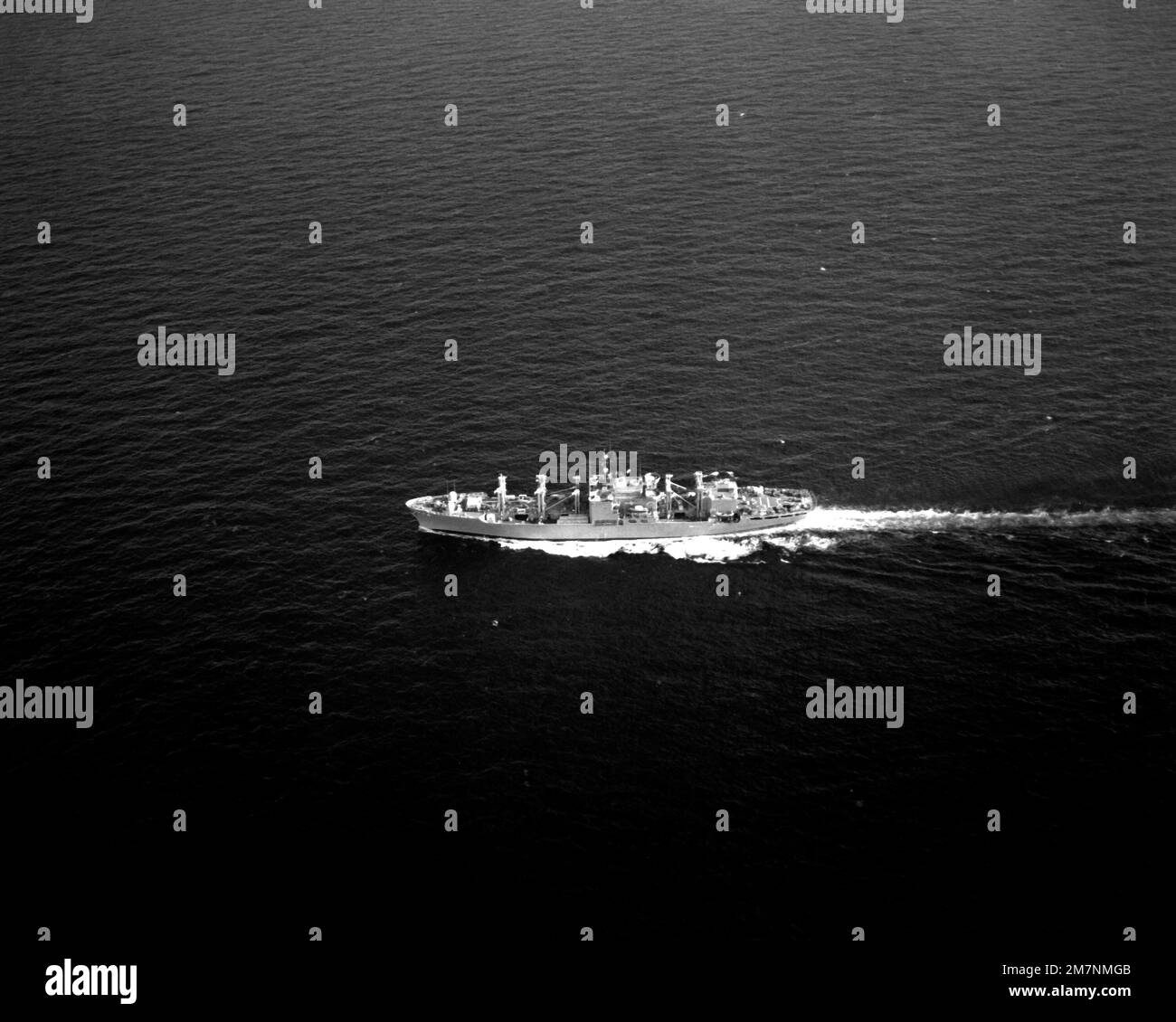 An aerial port beam view of the combat stores ship USS WHITE PLAINS ...