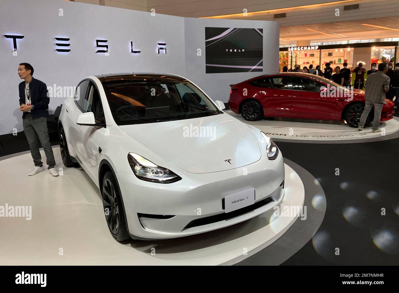 Tesla electric vehicles are displayed during a public launching event ...