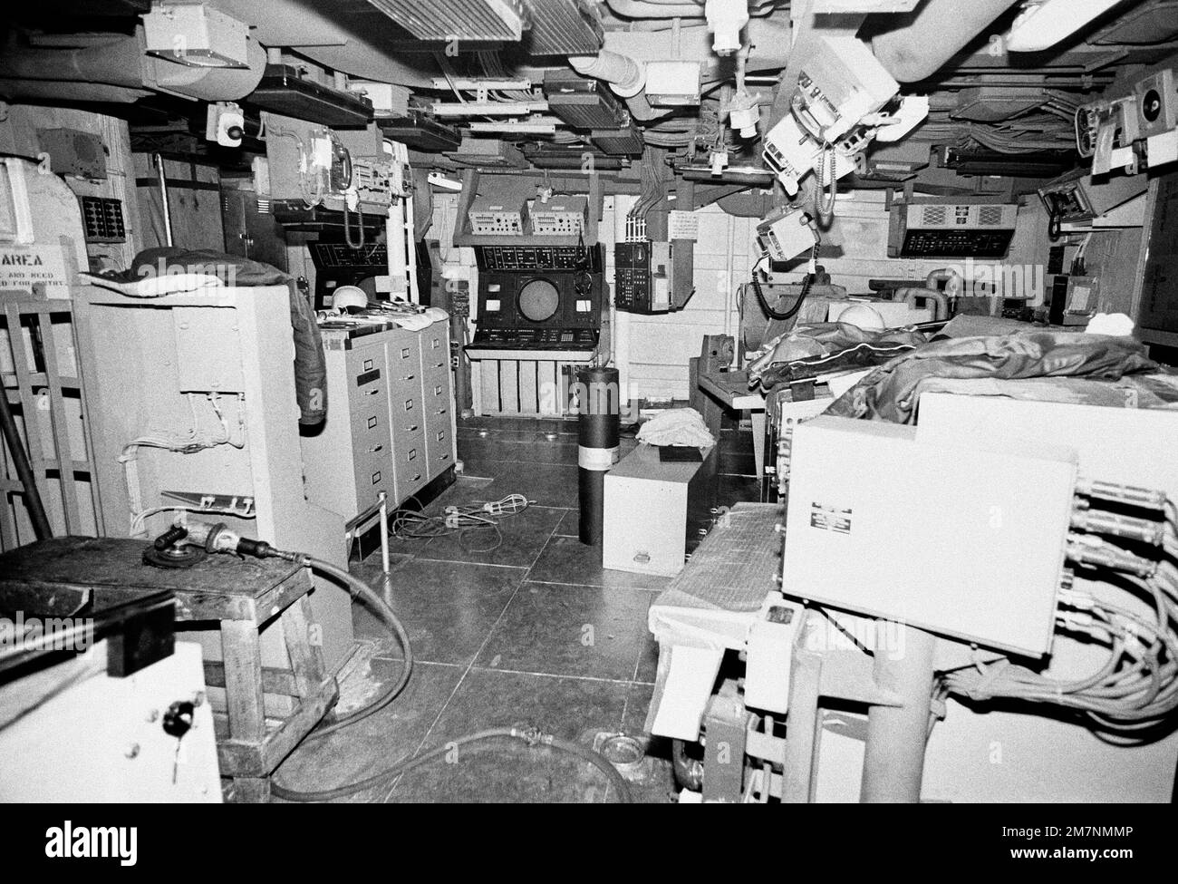 An interior view of the combat information center on the guided missile ...