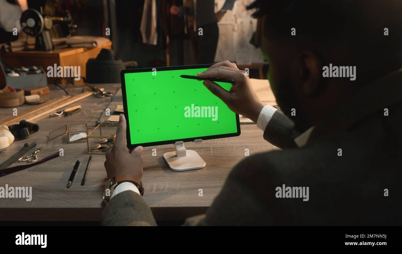 African american tailor drawing clothes hi-res stock photography and ...