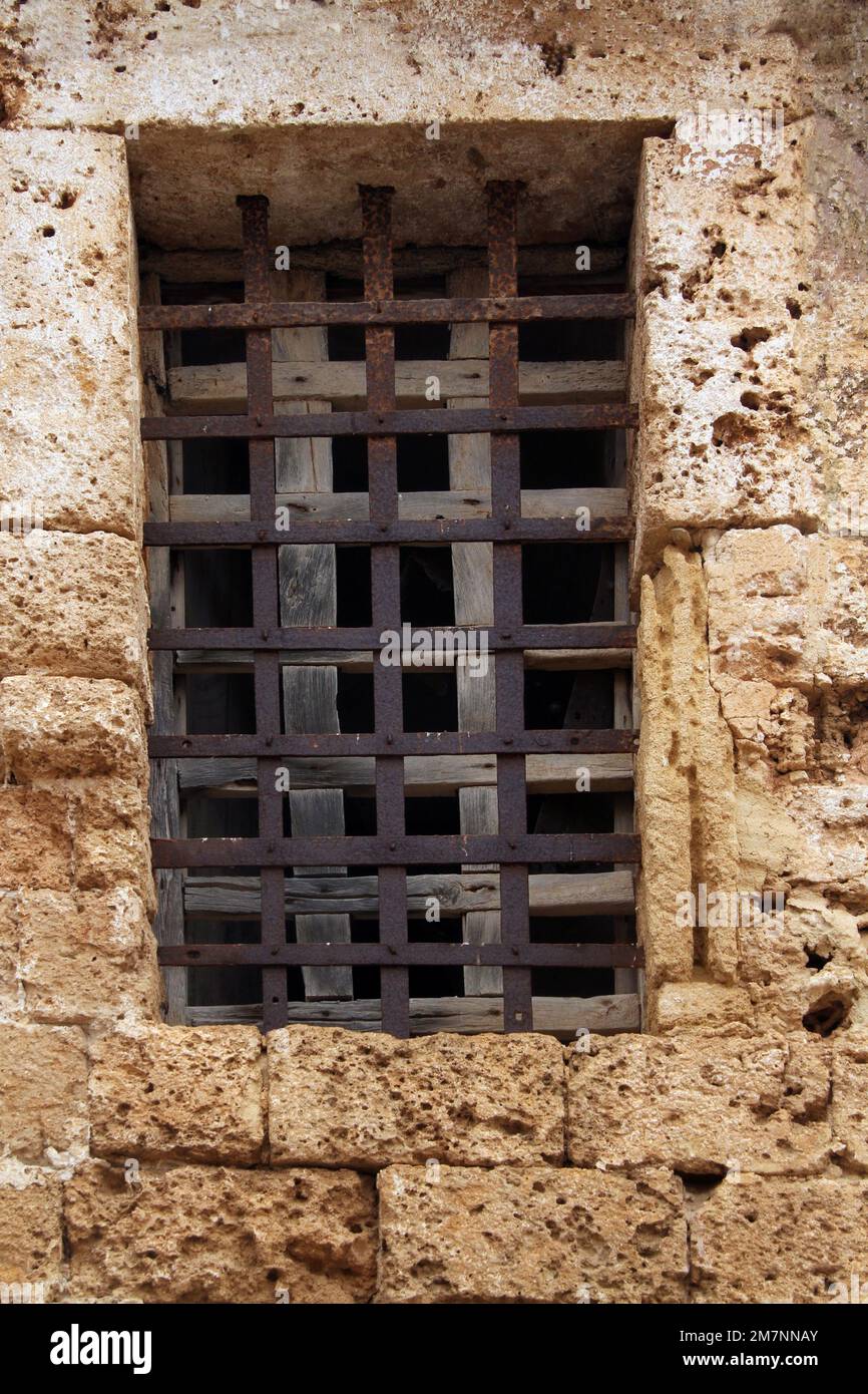 Metal grilled window of a building in the historical center of Felline ...
