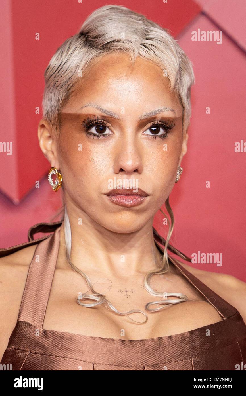 Poppy Ajudha poses for photographers upon arrival at the British ...