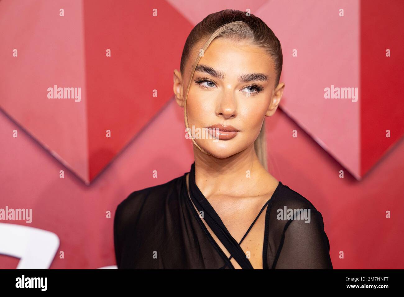 Jess Hunt poses for photographers upon arrival at the British Fashion ...