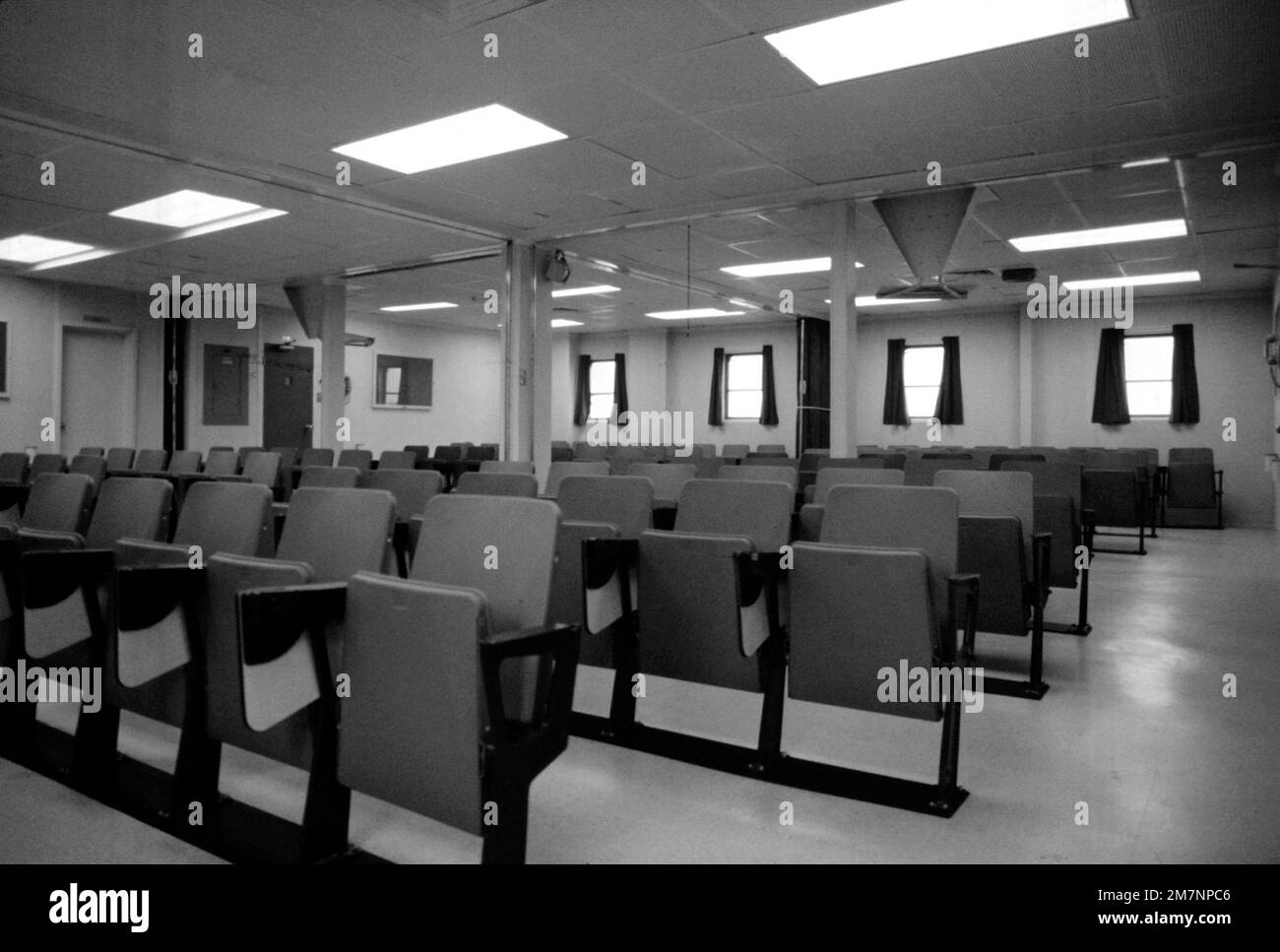 Seats in a classroom/auditorium aboard a large non-self-propelled ...