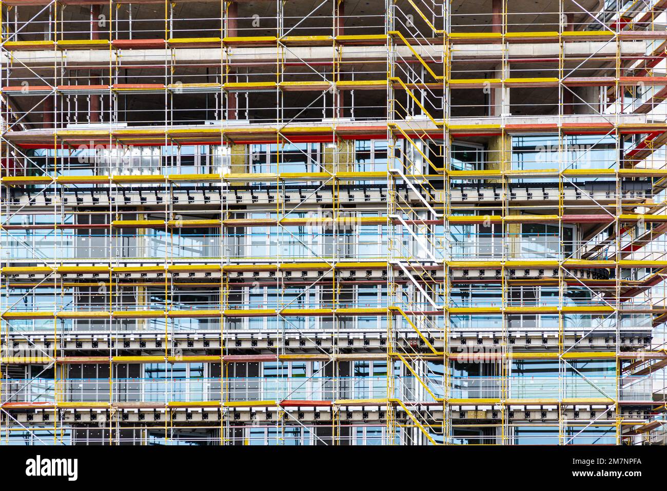 Building featuring numerous windows with construction scaffolding in ...