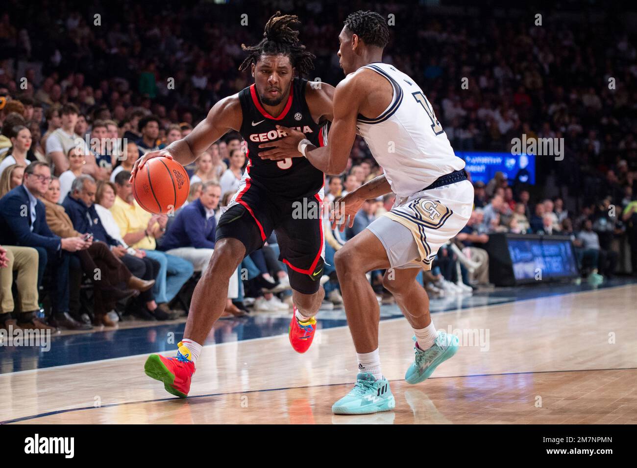 Georgia guard Kario Oquendo drives against Georgia Tech guard Tristan ...