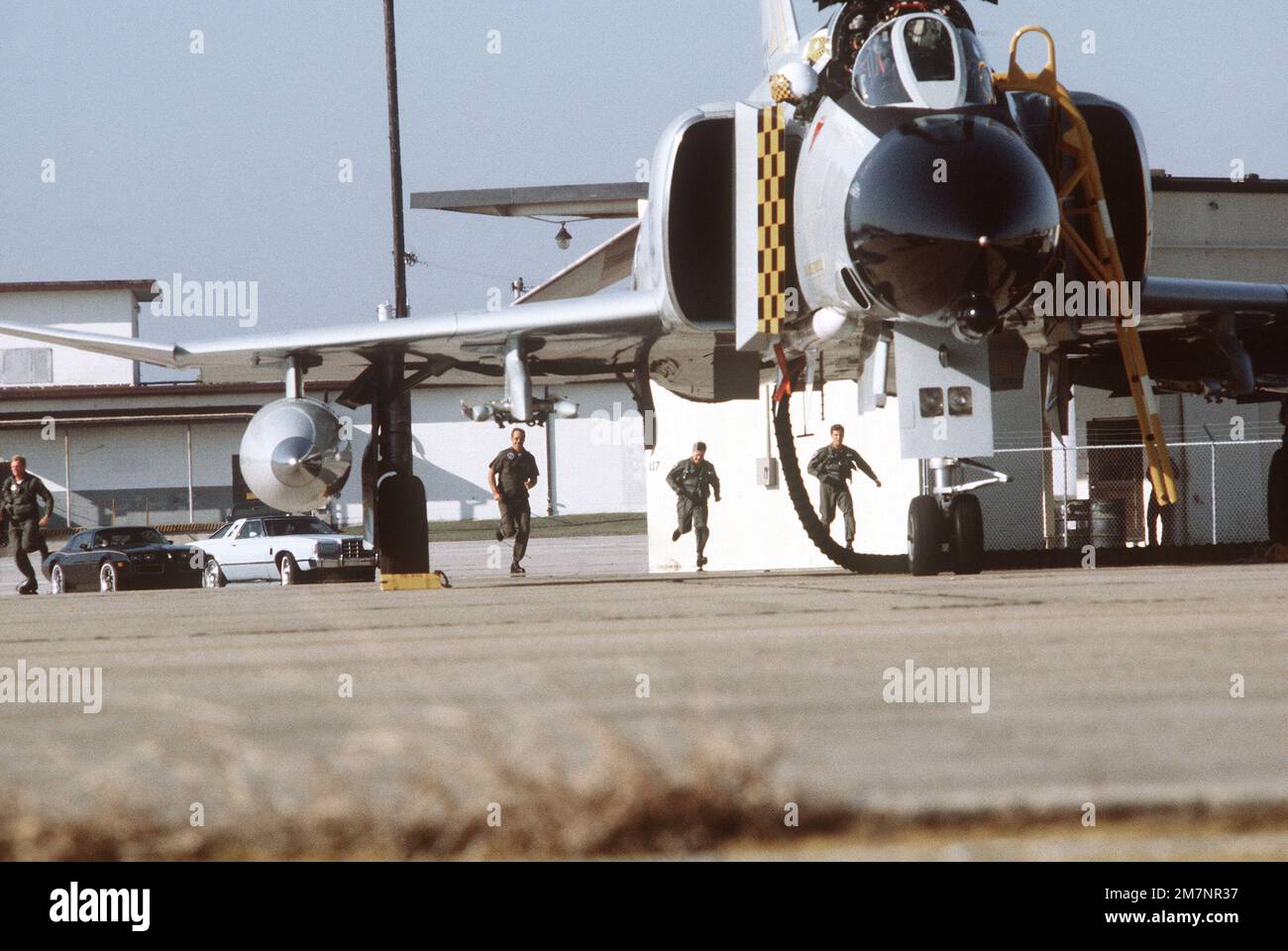 Pilots scramble to their F-4 Phantom II aircraft on alert during ...