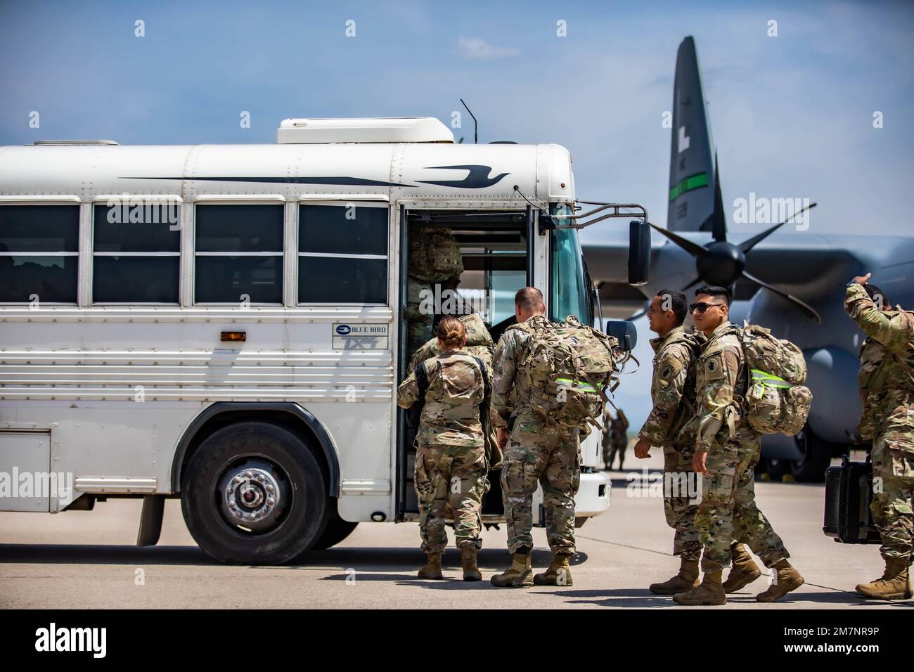 U.S. Army South Soldiers board a bus beginning a contingency command ...