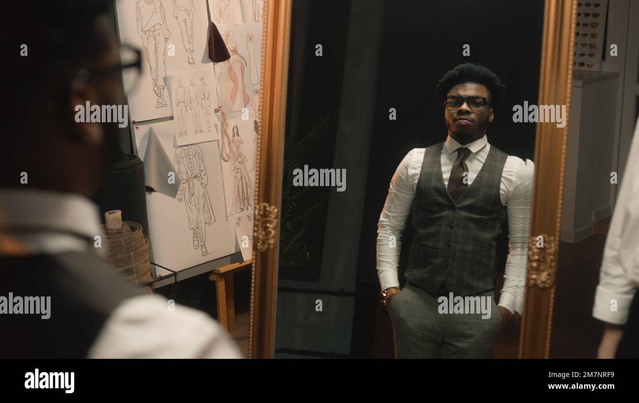 African American man on suit fitting in stylish designer atelier or in ...