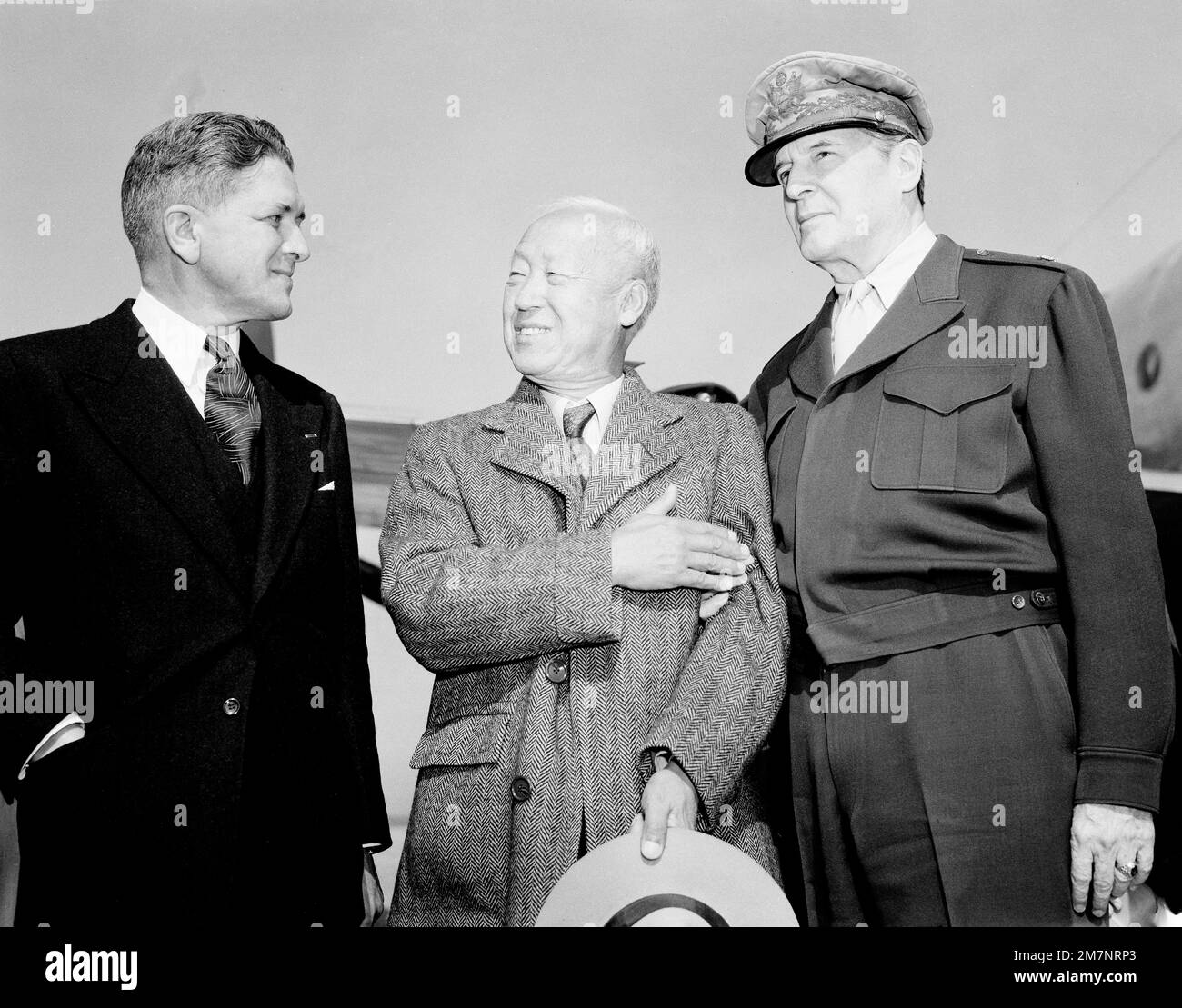 Gen. Douglas MacArthur is shown when he held the arm of President ...