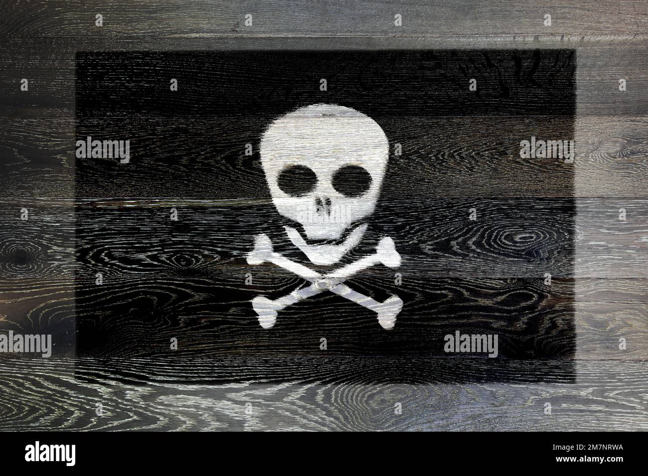 Jolly roger flag on rustic old wood surface background Stock Photo - Alamy