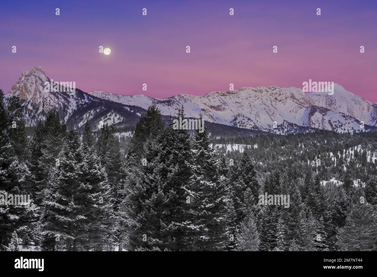Full moon setting above the mountains hi-res stock photography and ...