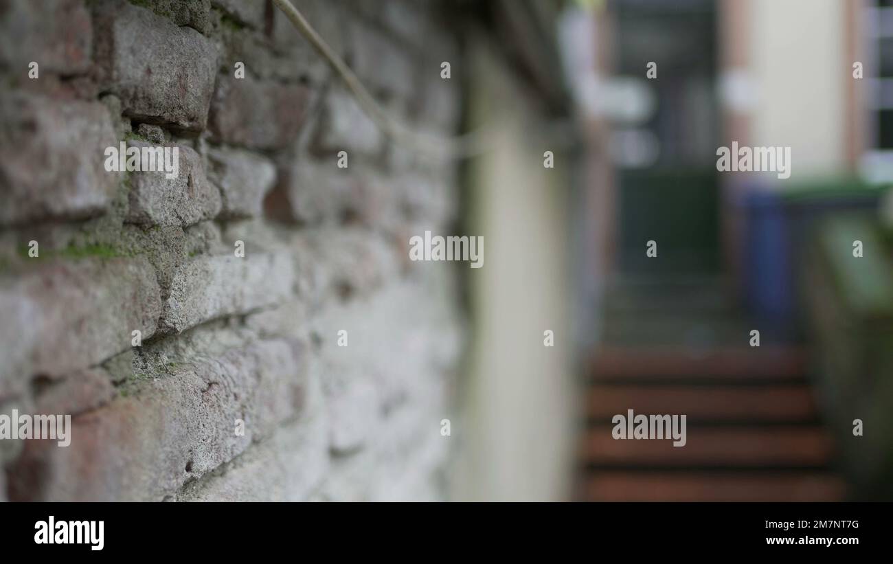 Brick wall out of focus exit door Stock Photo - Alamy