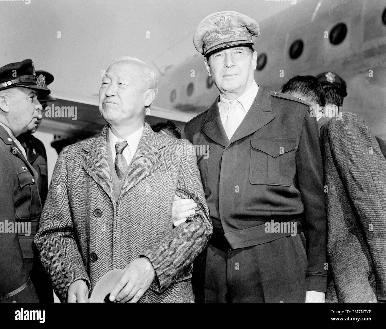 Gen. Douglas MacArthur is shown when he held the arm of President ...