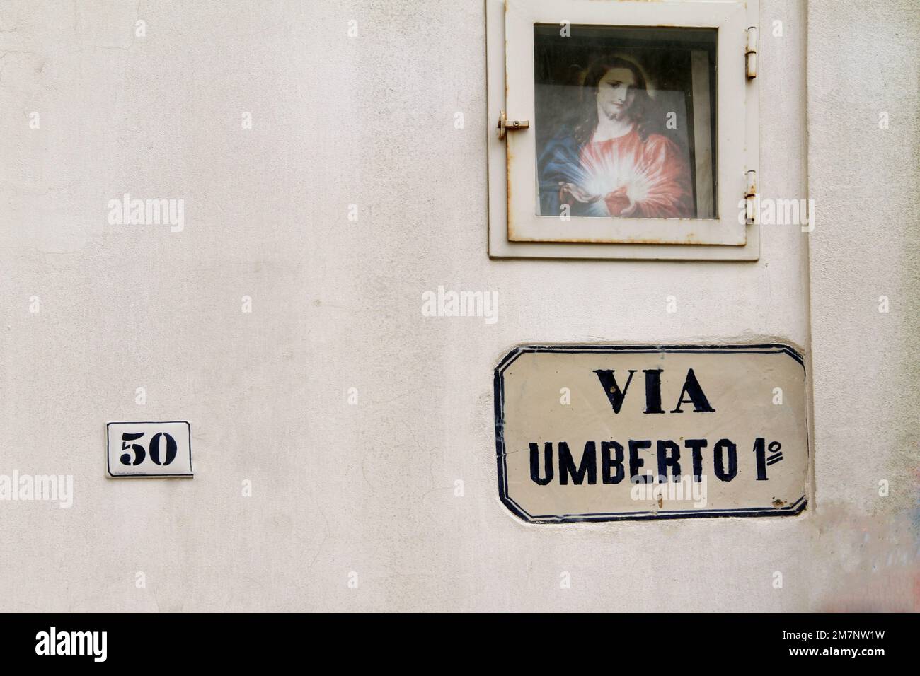 Racale, Italy. Religious artwork in an insert on the facade of a ...