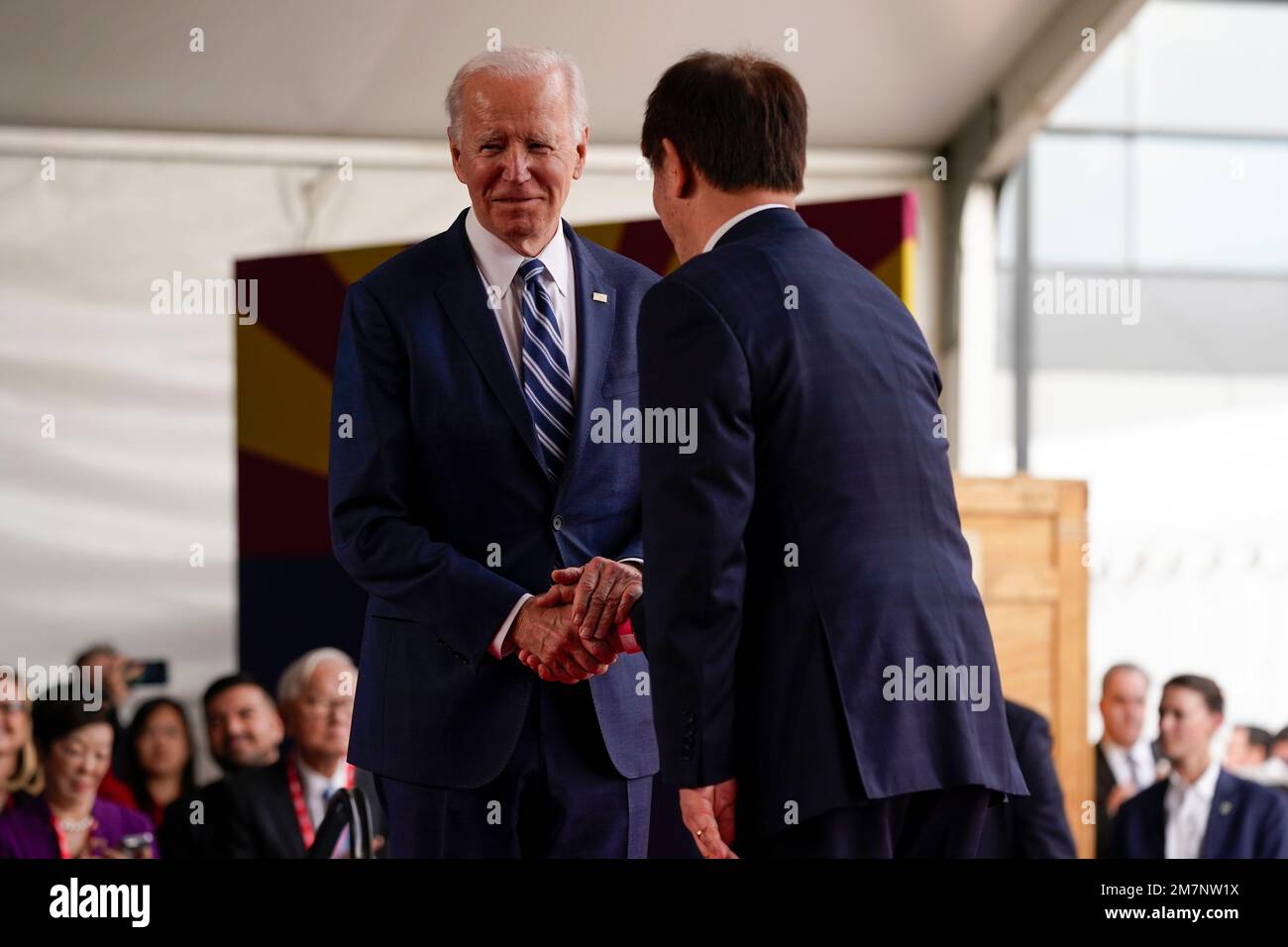 President Joe Biden greets TSMC chairman Mark Luises before he speaks ...