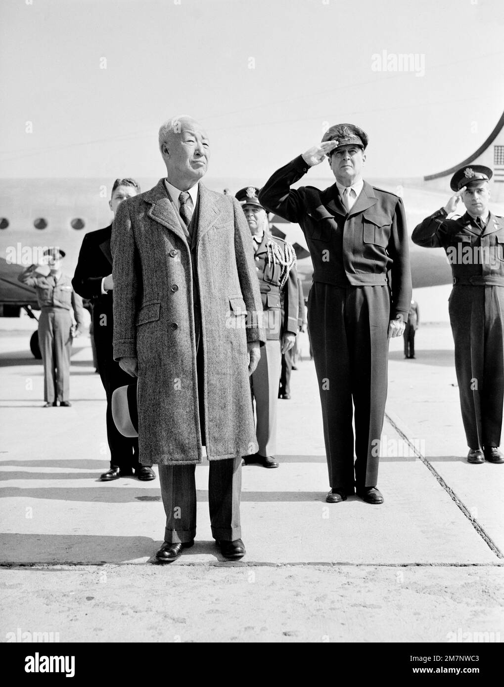 Gen. Douglas MacArthur is shown saluting President Syngman Rhee of the ...