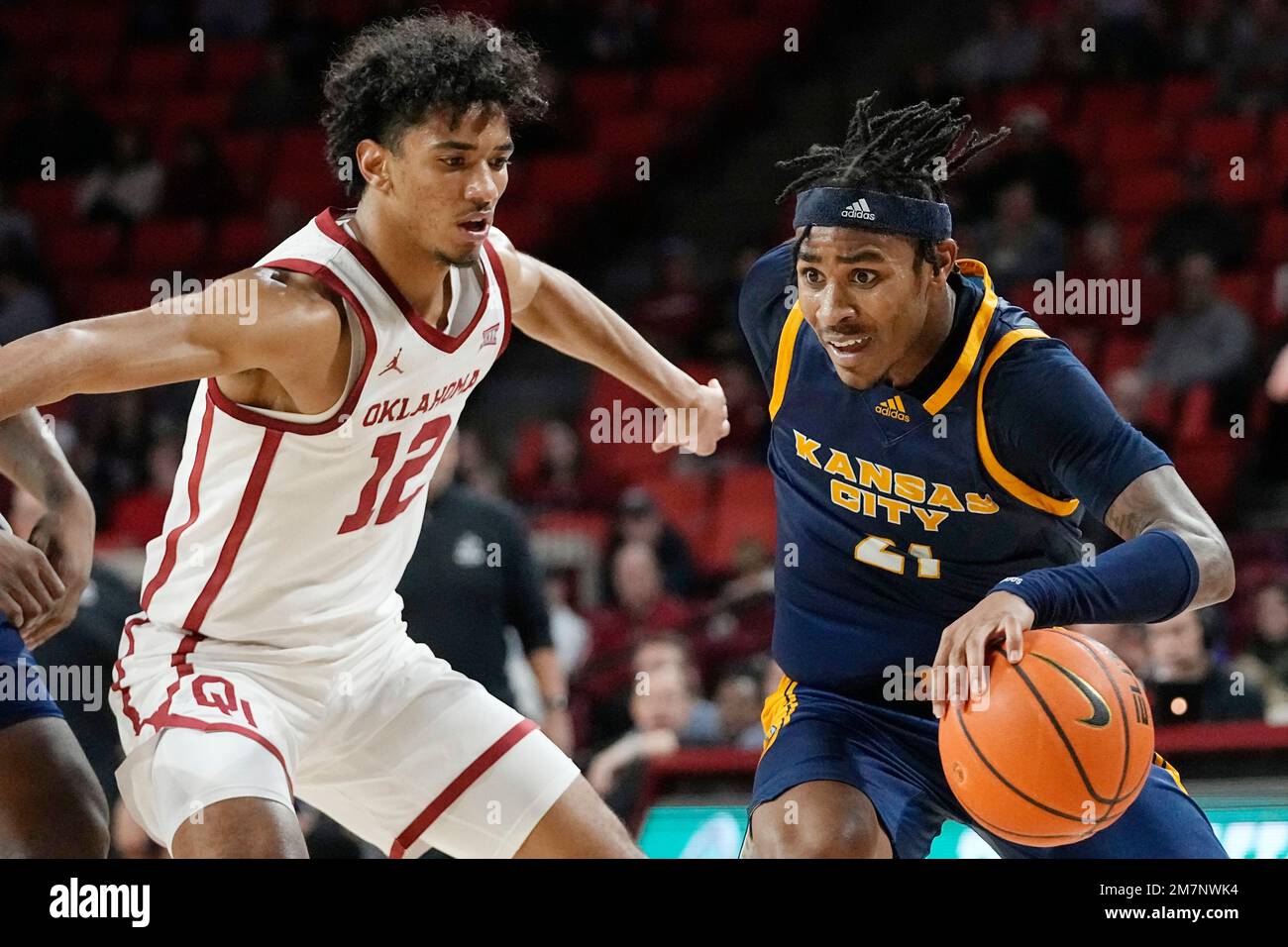 Kansas City guard RayQuawndis Mitchell drives past Oklahoma guard Milos ...