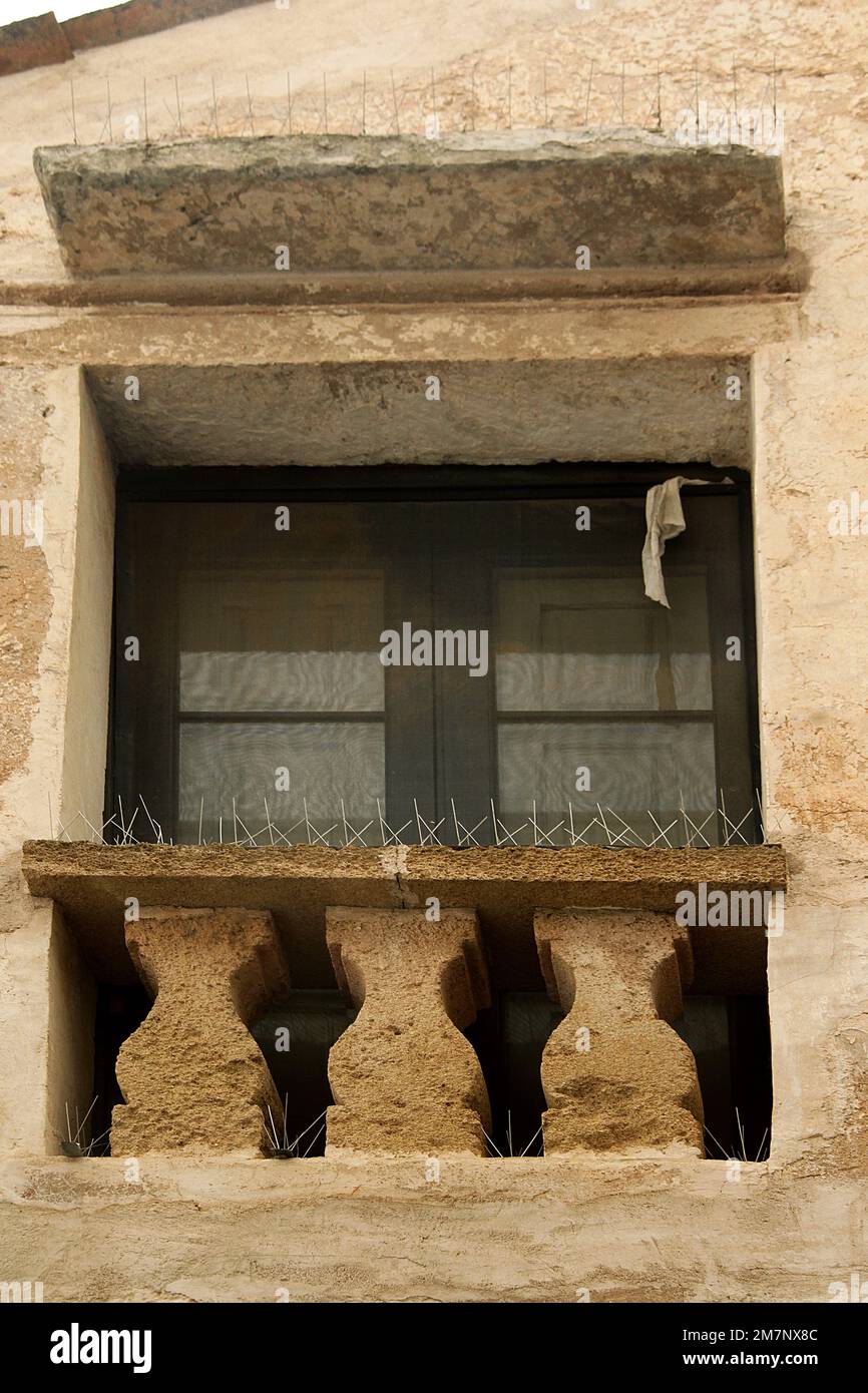 Architectural design around window in the old center of Racale, Italy ...