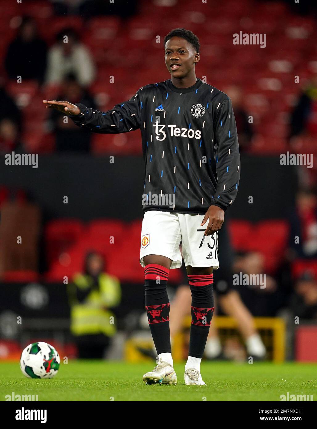 Manchester United's Kobbie Mainoo warms up before the Carabao Cup ...