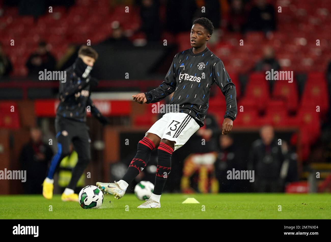 Manchester United's Kobbie Mainoo warms up before the Carabao Cup ...