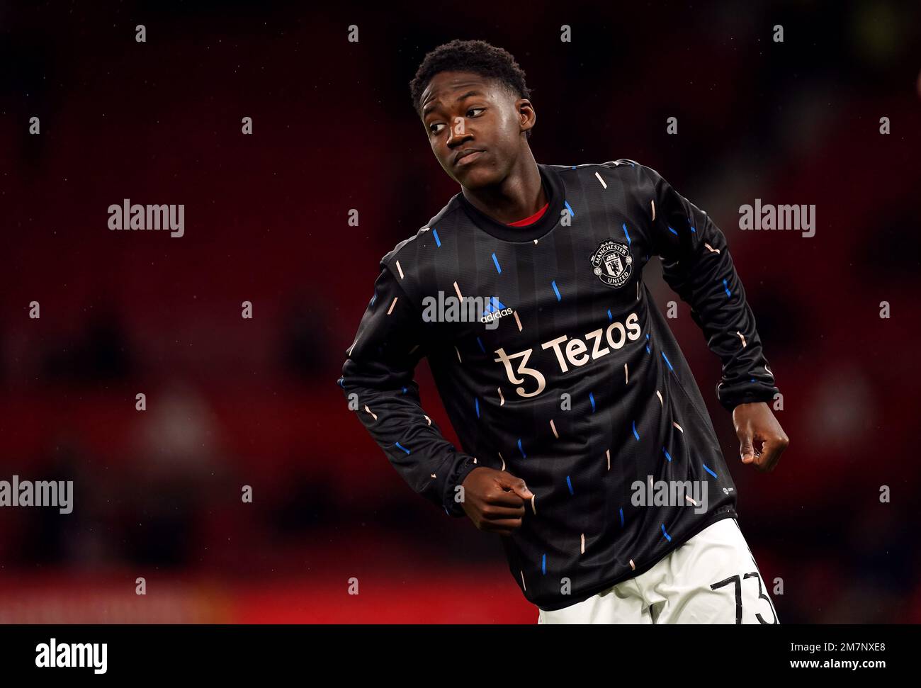 Manchester United's Kobbie Mainoo warms up before the Carabao Cup ...