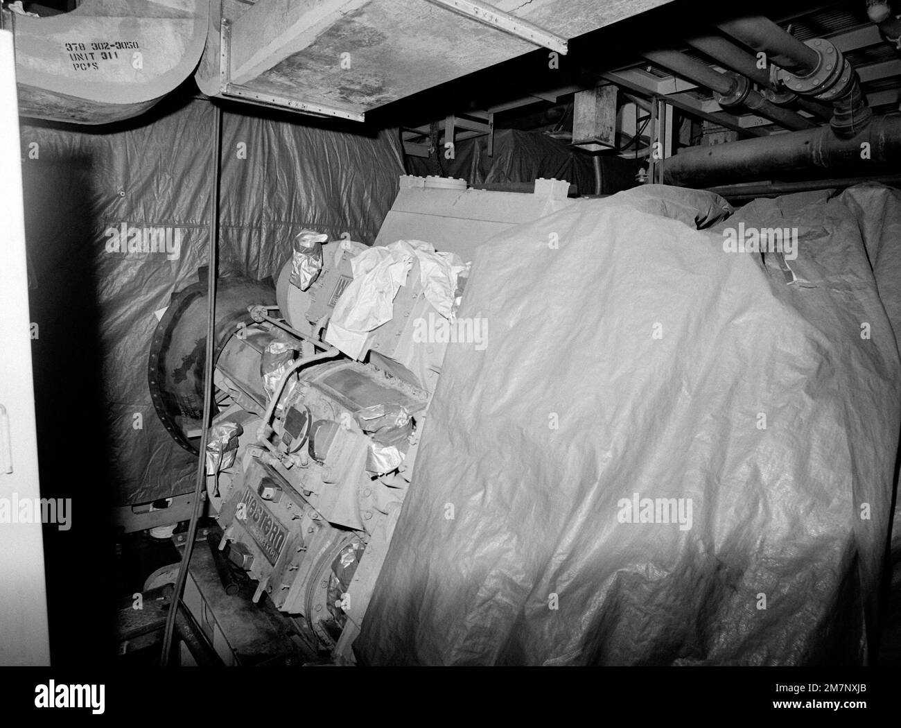 An interior view of the engine room on the guided missile frigate USS ...