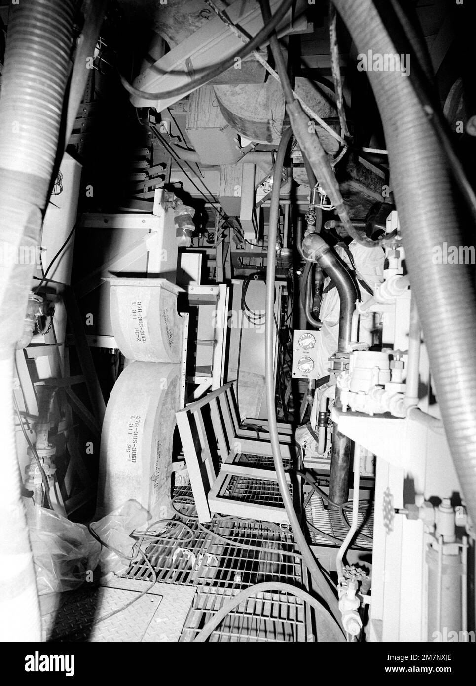 An interior view of auxiliary machine room No. 3 on the guided missile ...