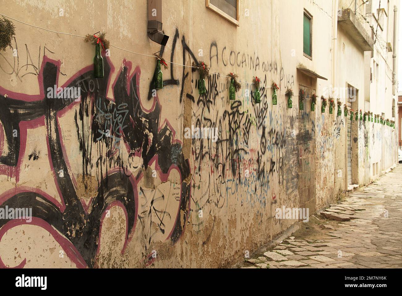 Spray paint graffiti over the facade of buildings in the historic ...