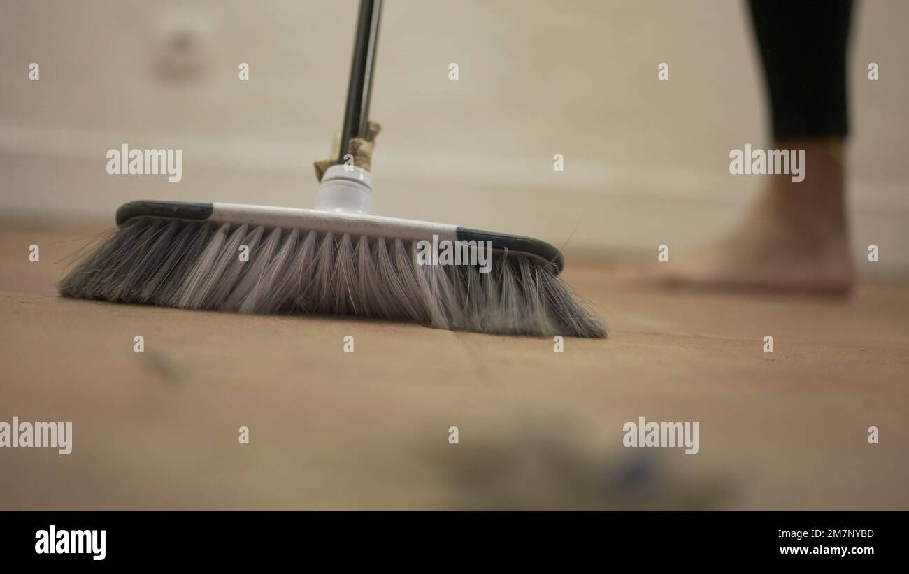 Person sweeping floor broomstick hi-res stock photography and images ...