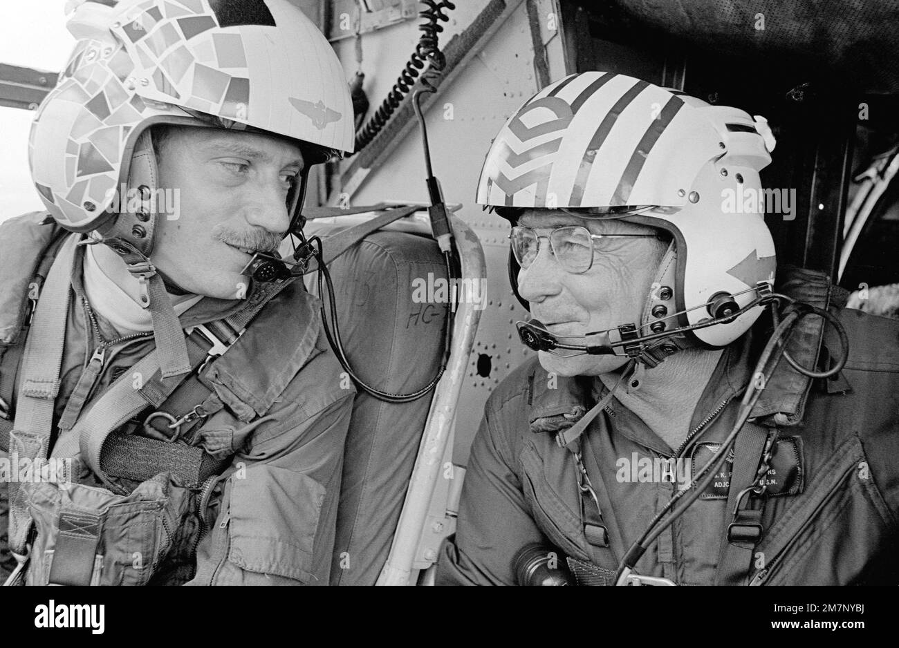 Lieutenant Commander Gregory Netzorg, left, pilot, and CHIEF Aviation ...