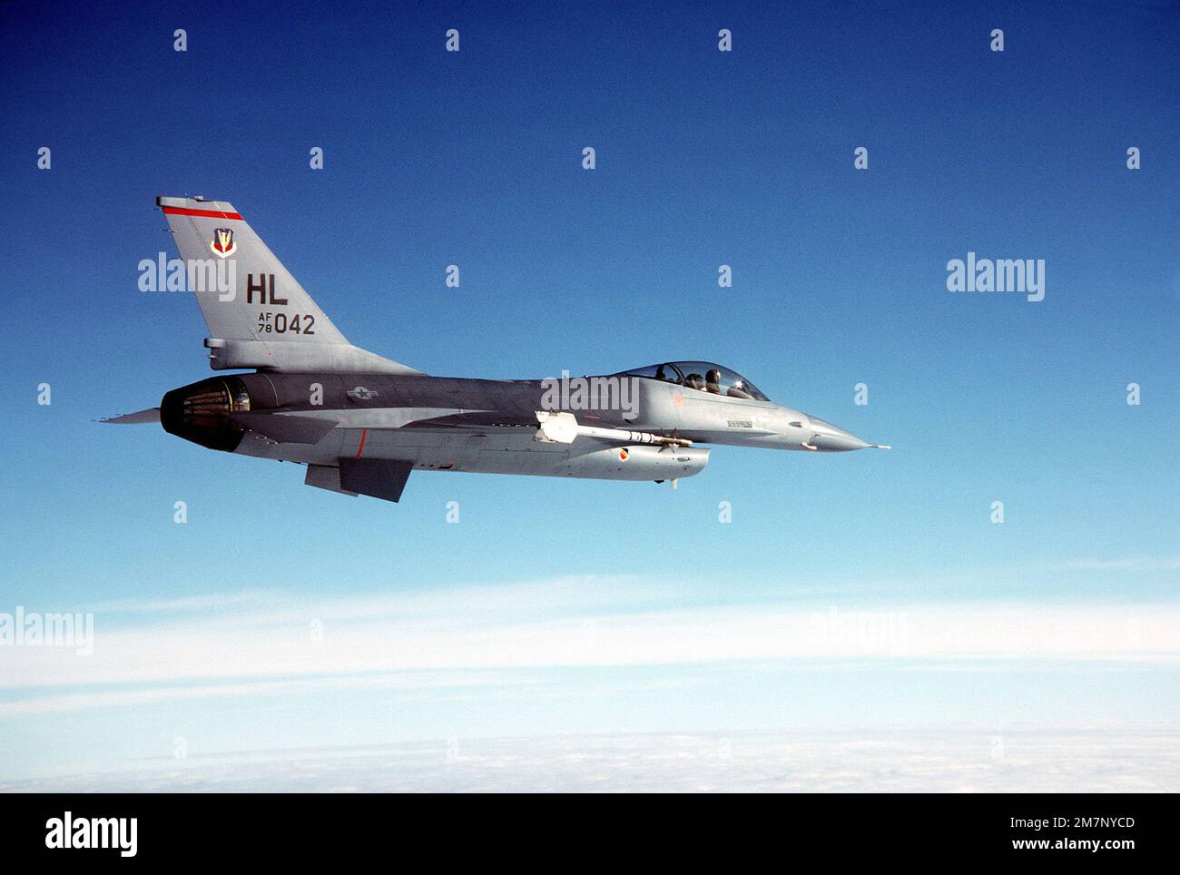 AN air-to-air right side view of an F-16 Fighting Falcon aircraft ...