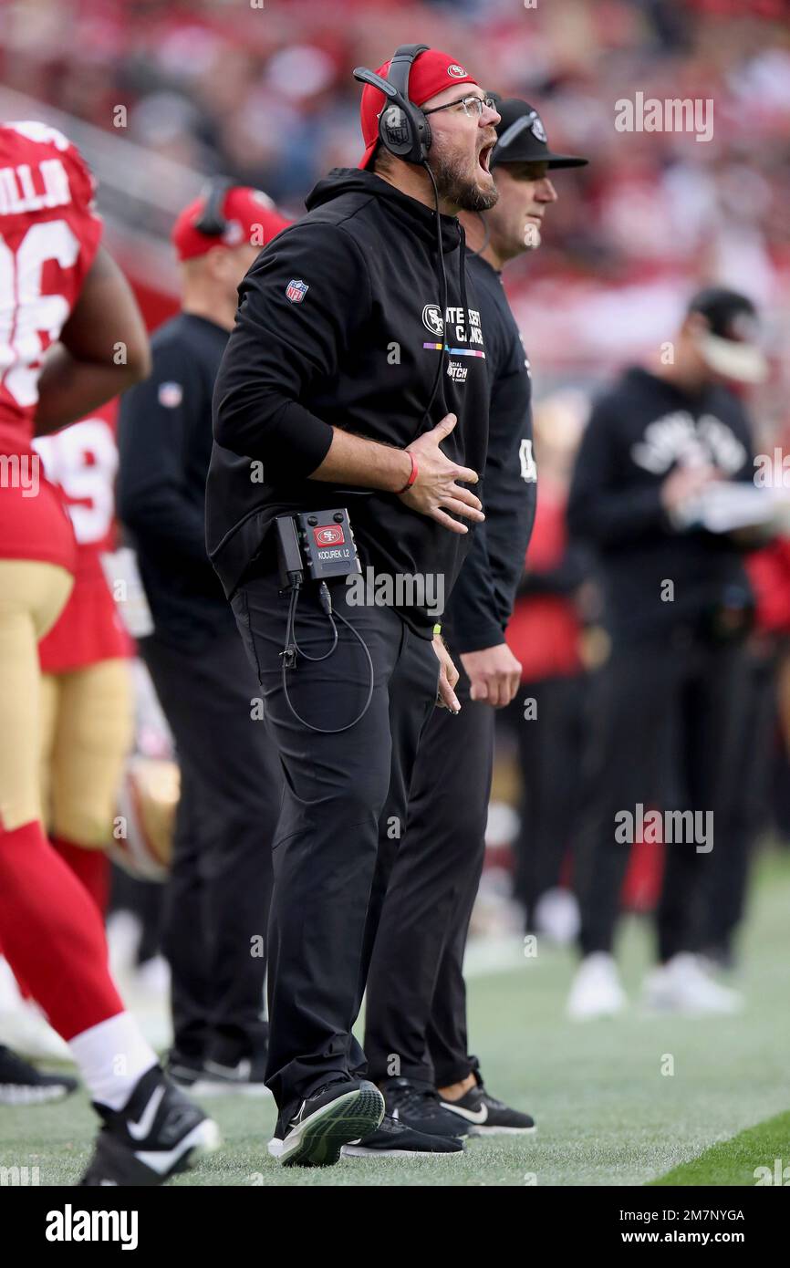 San Francisco 49ers defensive line coach Kris Kocurek stands on the ...