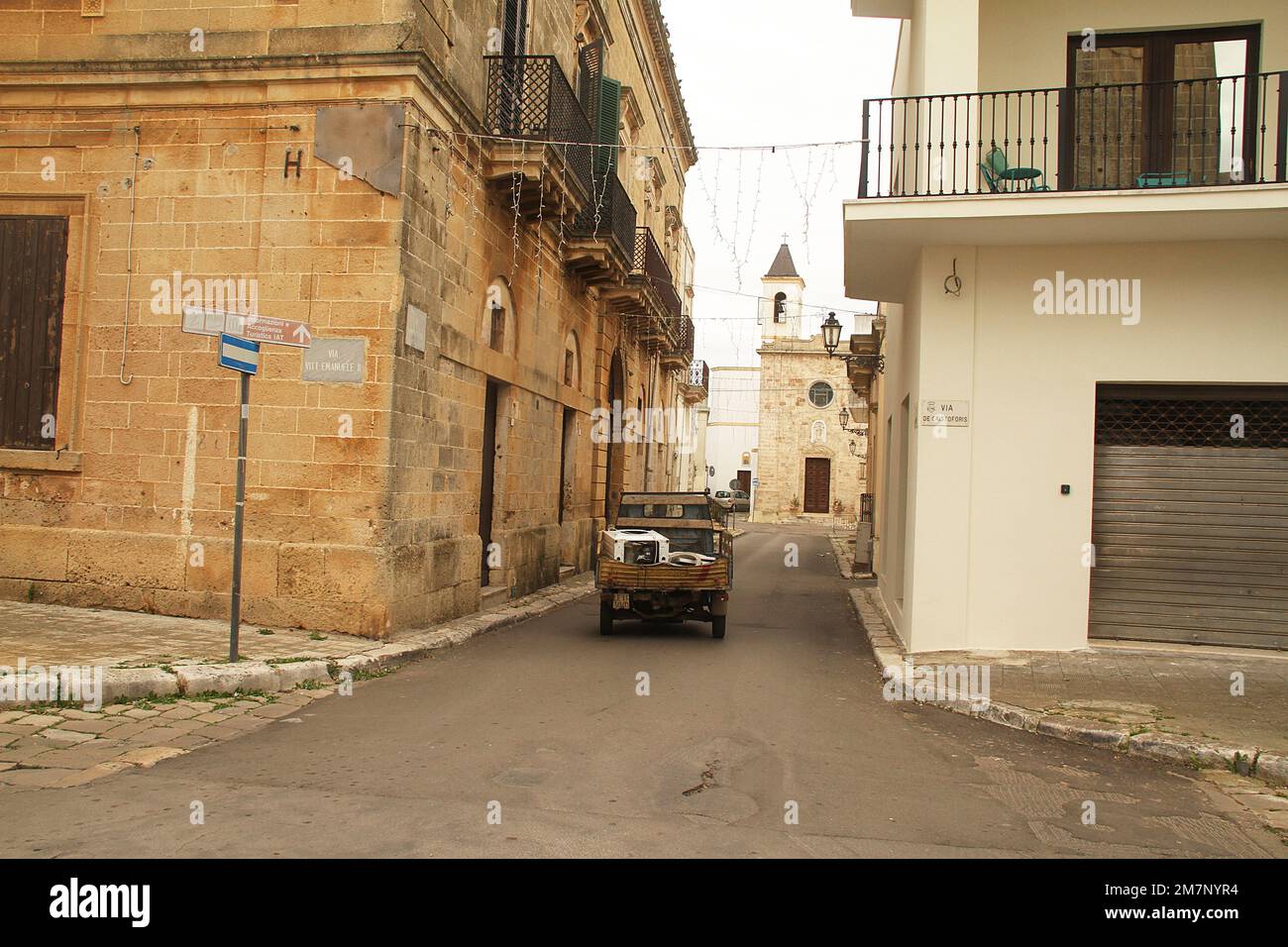 Car driving on narrow street hi-res stock photography and images - Alamy