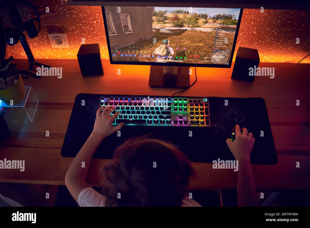 Image of immersed teenage gamer boy playing video games on computer in ...