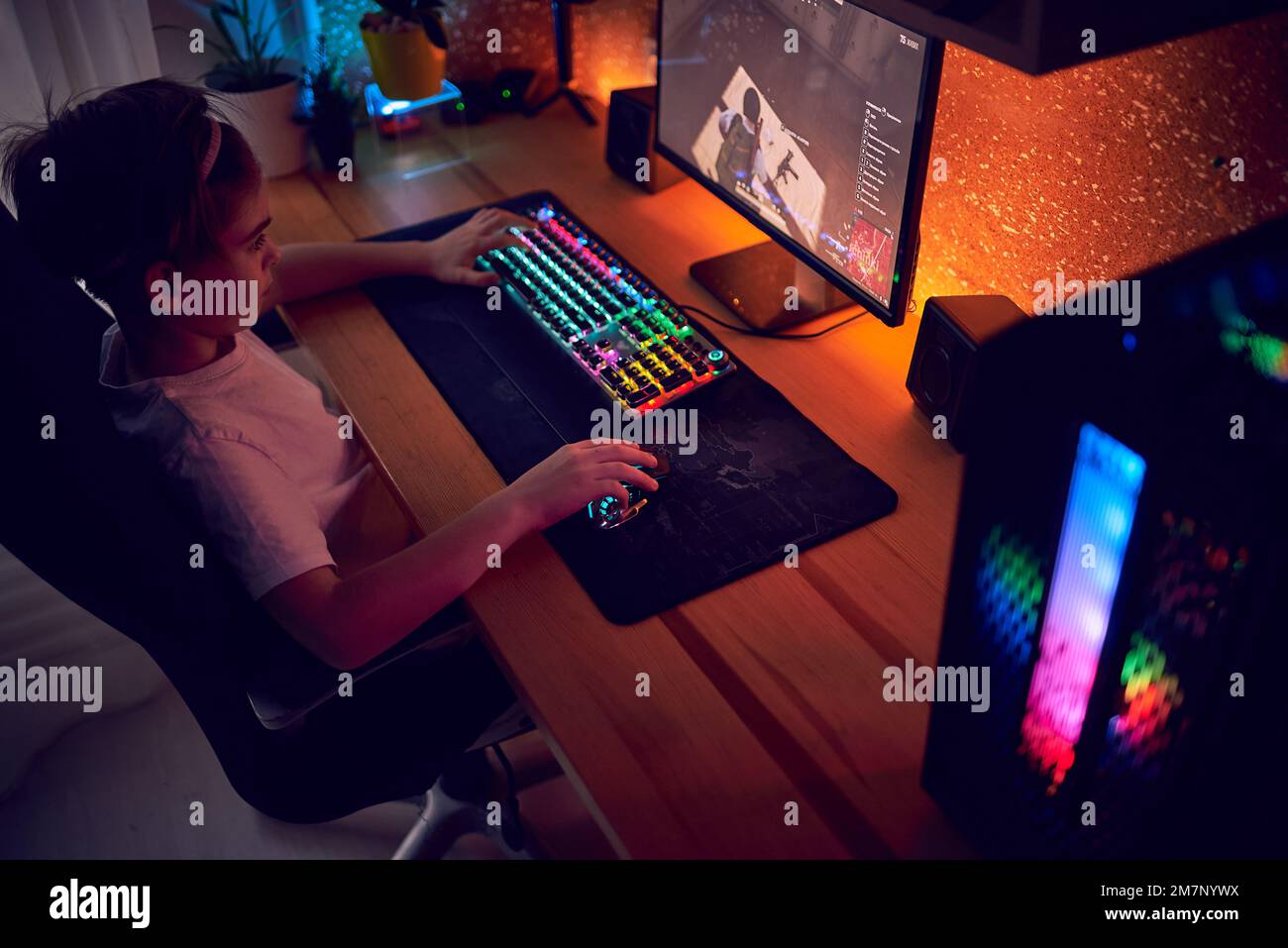 Image of immersed teenage gamer boy playing video games on computer in ...