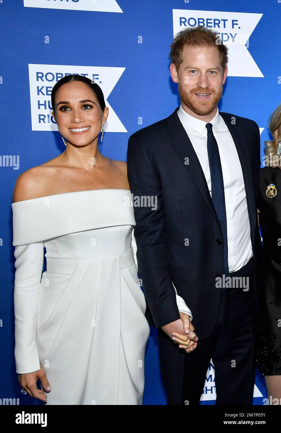 Meghan, Duchess of Sussex, left, and Prince Harry attend the Robert F ...