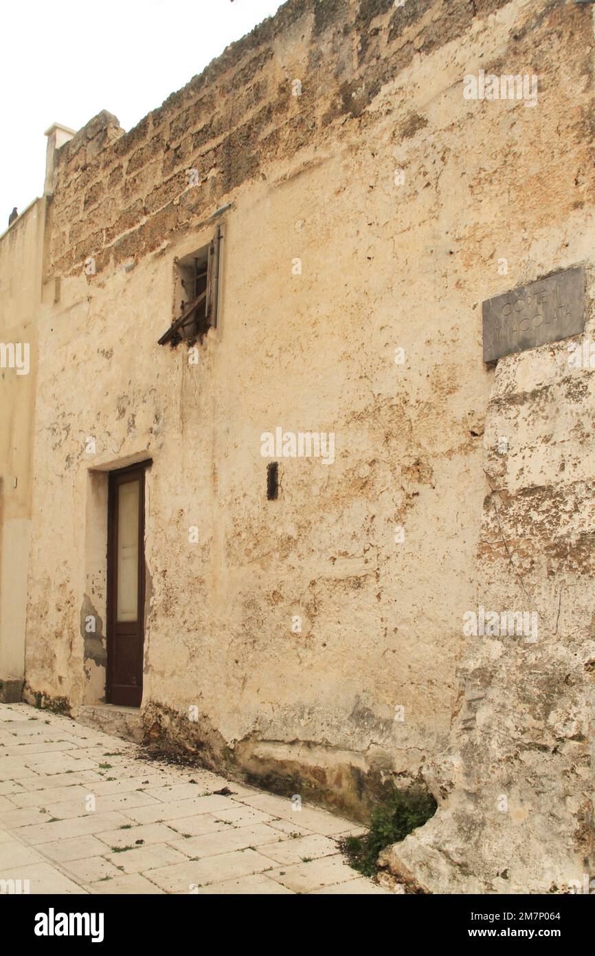 Neglected facade of a building in the historical center of Racale ...