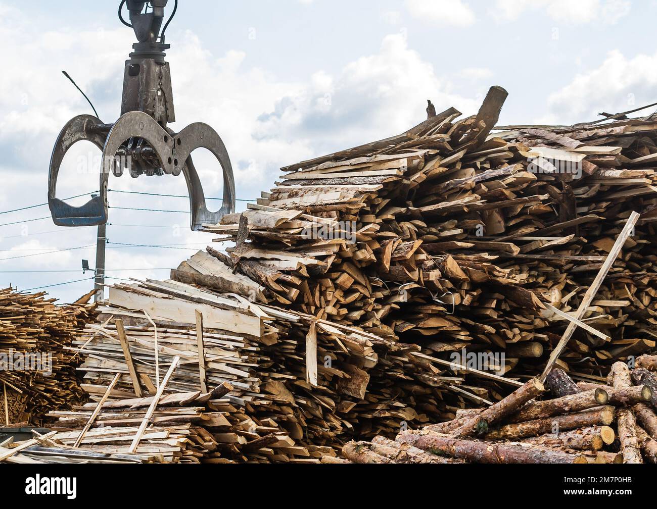 Log loader or forestry machine loads a log truck Stock Photo - Alamy