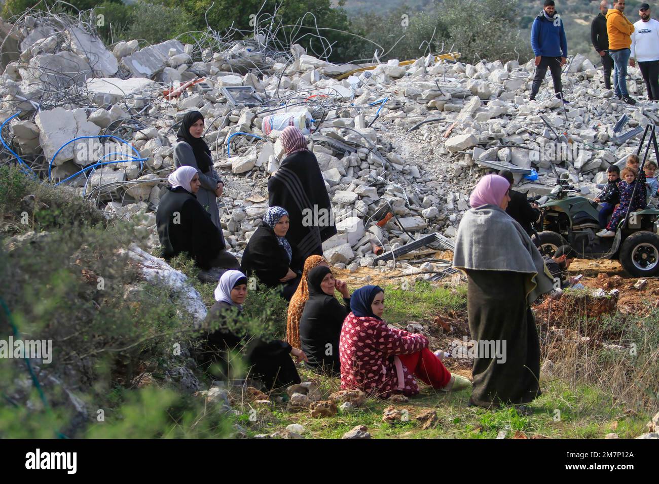 Salfit, Palestine. 10th Jan, 2023. A Palestinian family is seen near ...