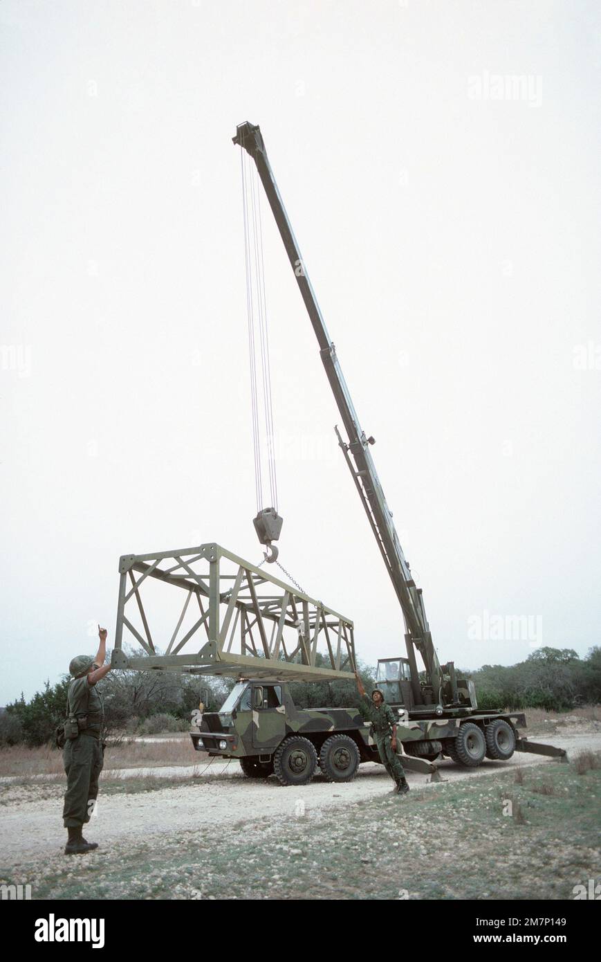 US Army engineers use an MT250 25-ton truck mounted hydraulic crane to ...