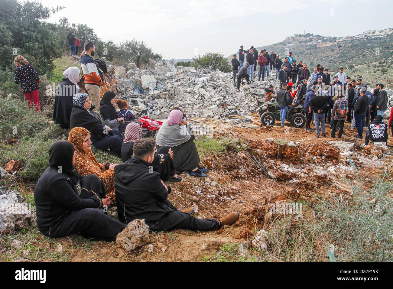 Salfit, Palestine. 10th Jan, 2023. A Palestinian family is seen near ...