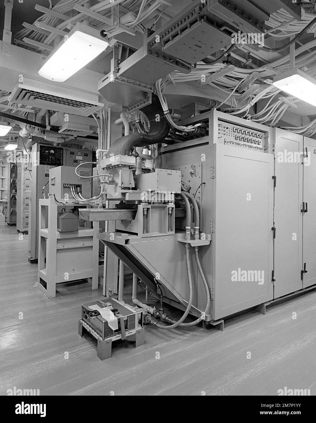 A view of the radar and combat information center equipment room aboard ...